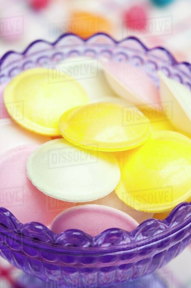 Flying saucer candies in a glass dish - Royalty-free Stock Photo | Dissolve