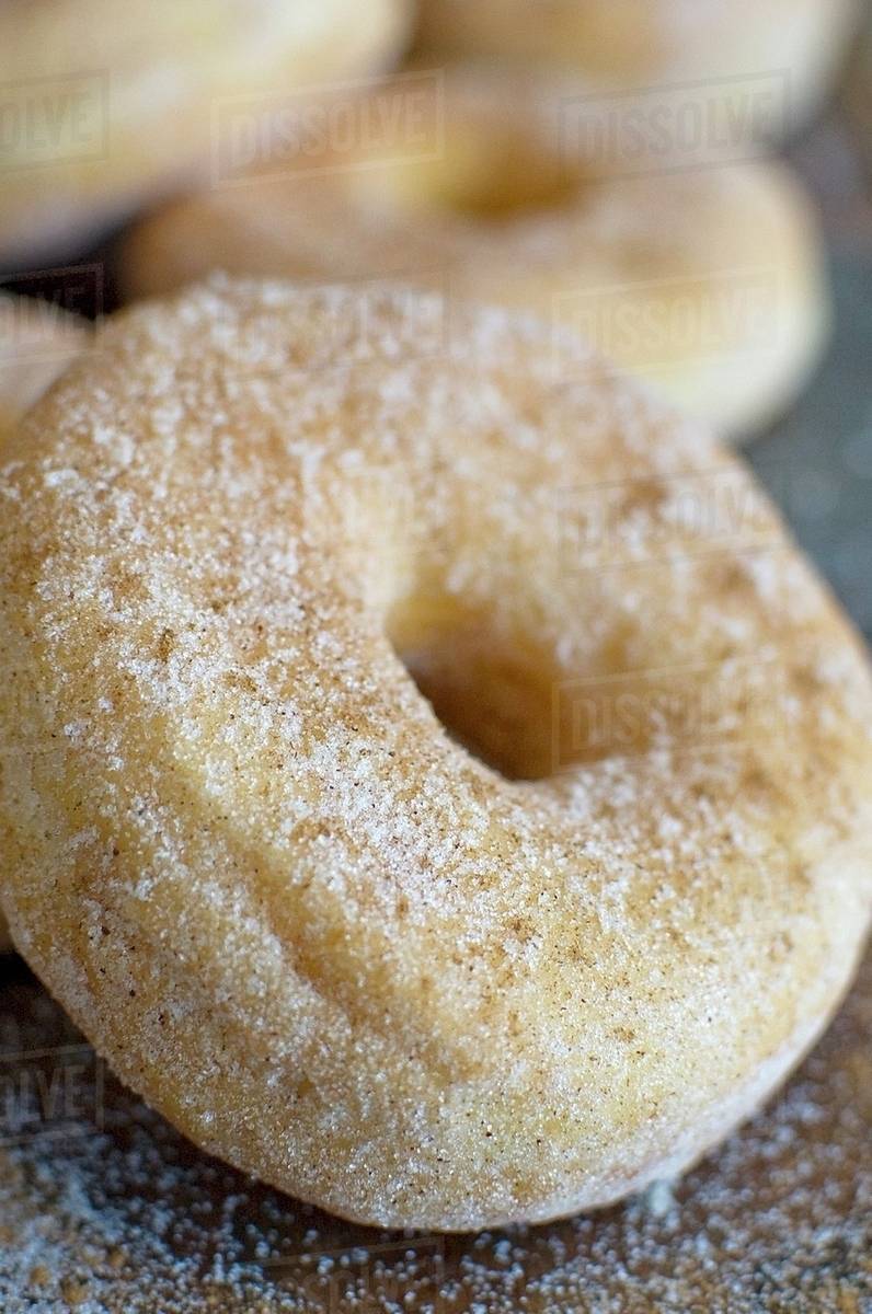 Doughnuts dusted with cinnamon sugar (close-up) - Royalty-free Stock ...