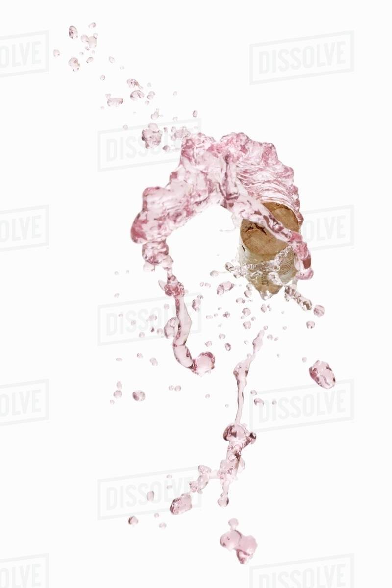 A splash of rose wine with a cork - Royalty-free Stock Photo | Dissolve