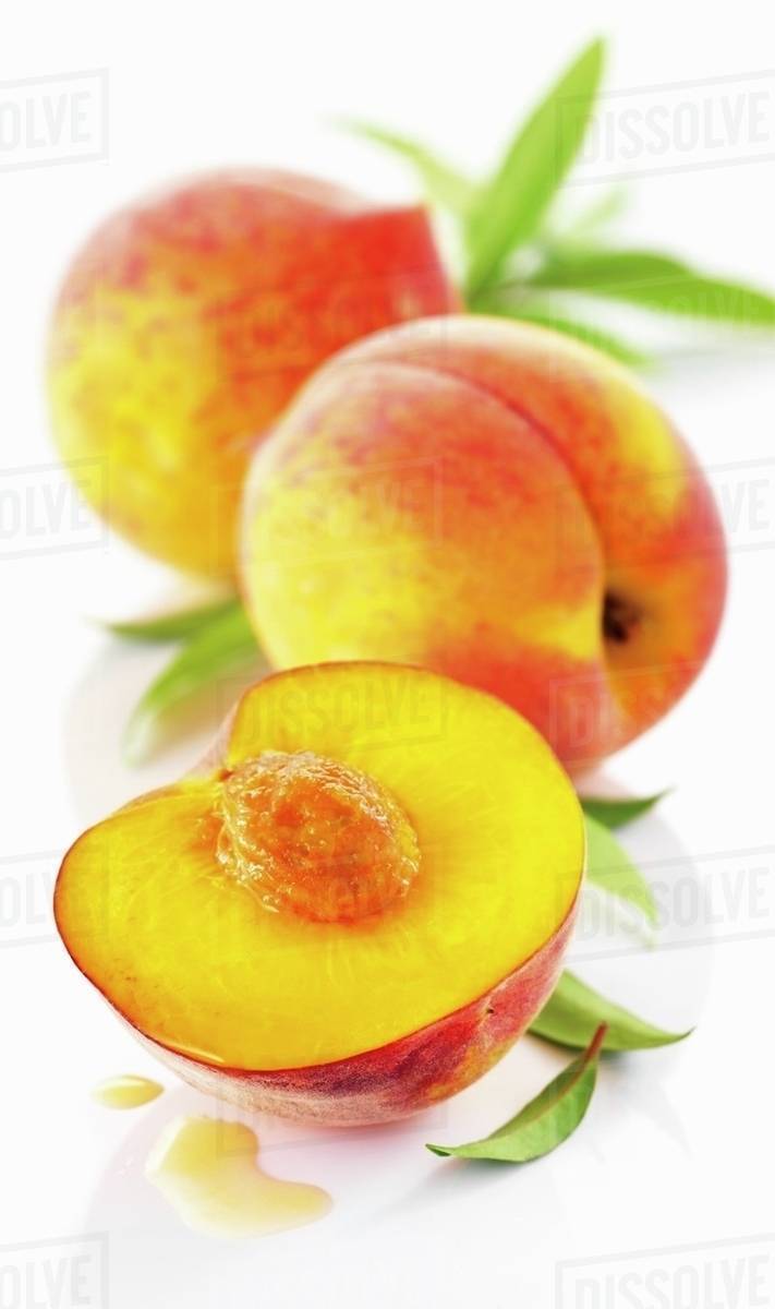 Yellow flesh peaches, whole and halved - Royalty-free Stock Photo ...