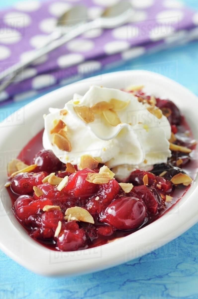 Stewed cranberries topped with creamy coconut and slivered almonds ...