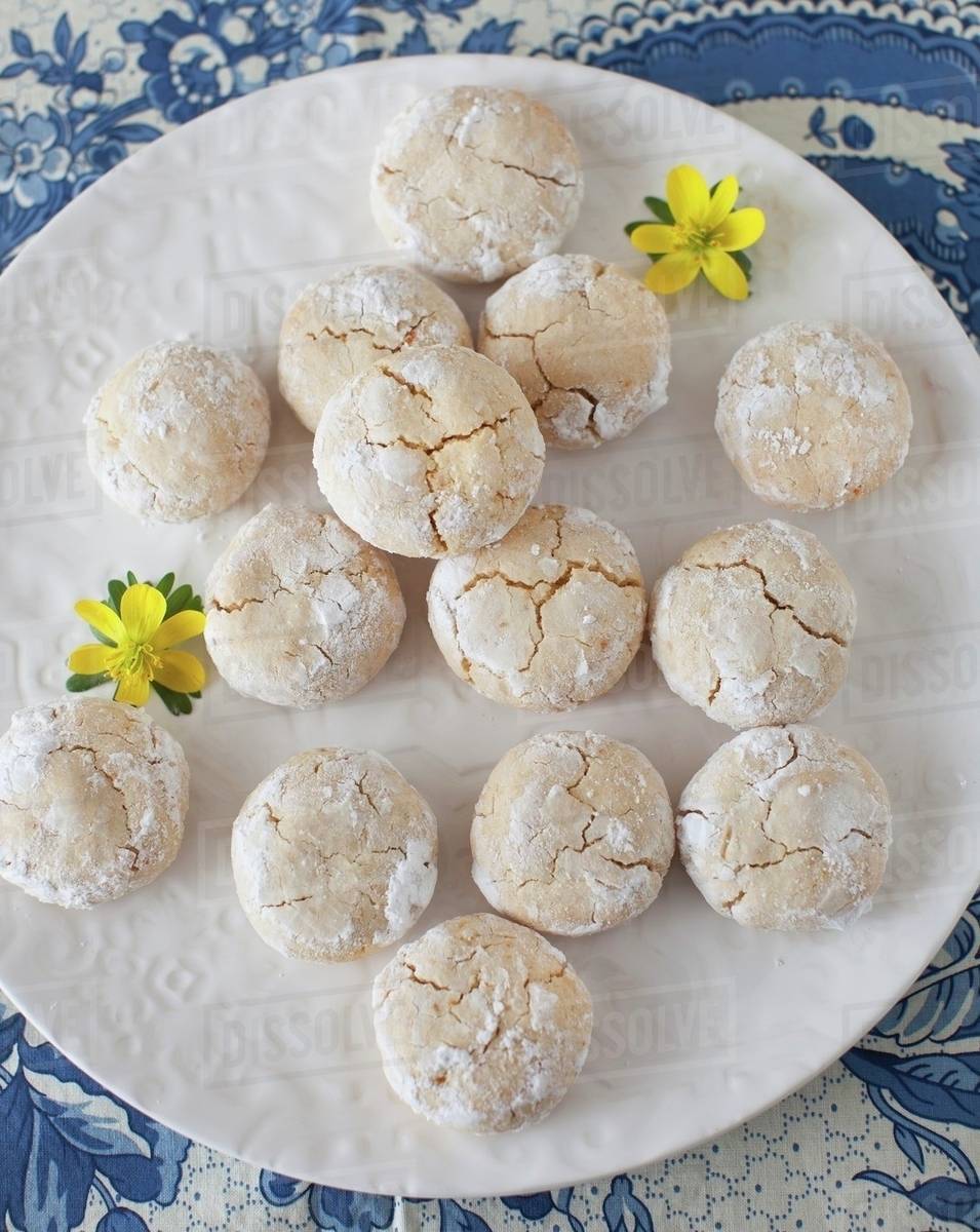 Orange and coconut biscuits made using quark dough, on a white plate ...