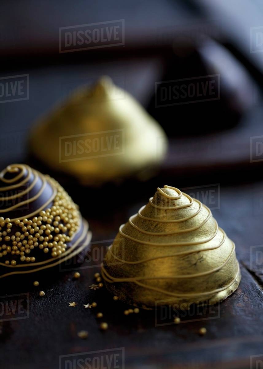 Golden pyramid chocolates - Royalty-free Stock Photo | Dissolve