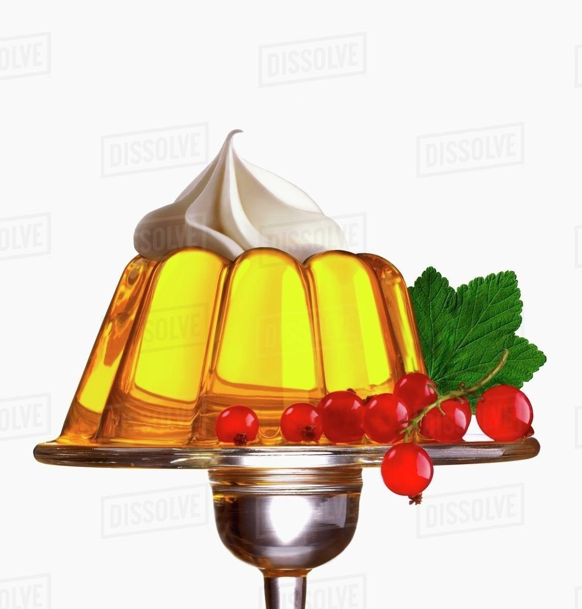 Golden jelly with a dab of whipped cream on top - Royalty-free Stock ...
