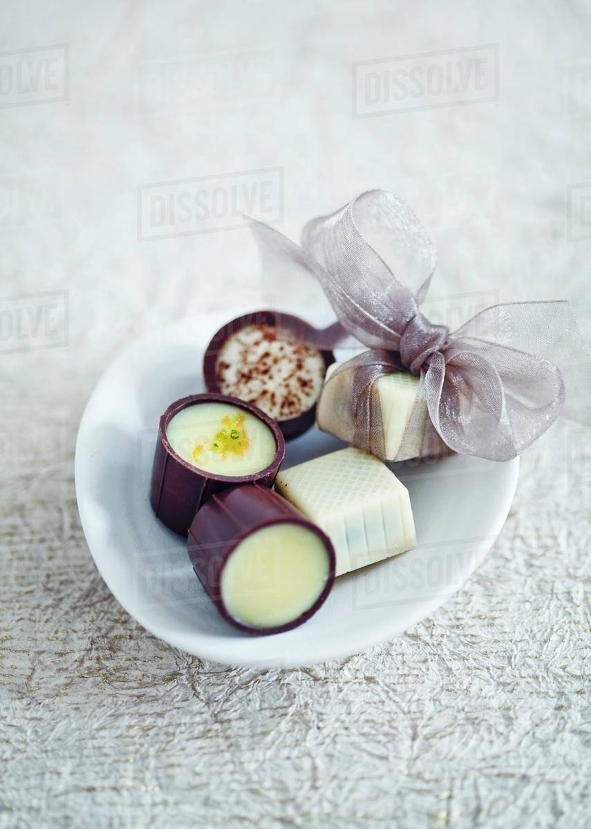 Assorted chocolate pralines on a plate - Royalty-free Stock Photo ...