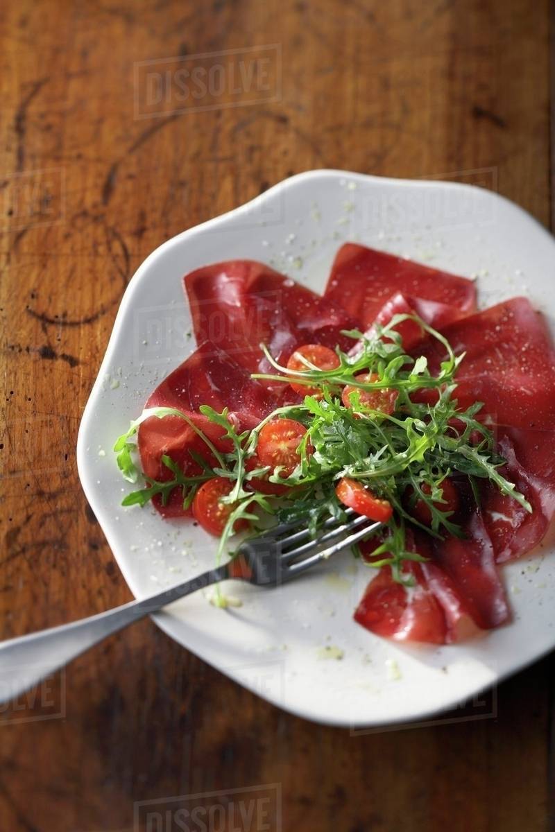 Carpaccio of Grisons air-dried beef with rocket - Royalty-free Stock ...