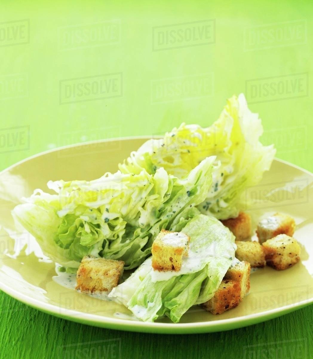 Iceberg lettuce with croutons - Royalty-free Stock Photo | Dissolve