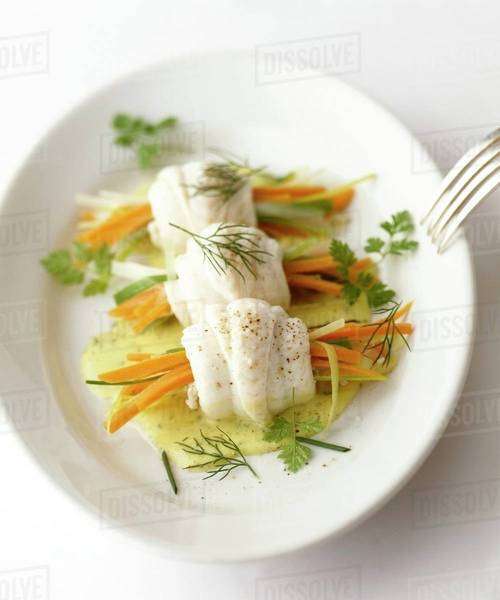 Rolled sole fillets with vegetables julienne and herbs - Royalty-free ...