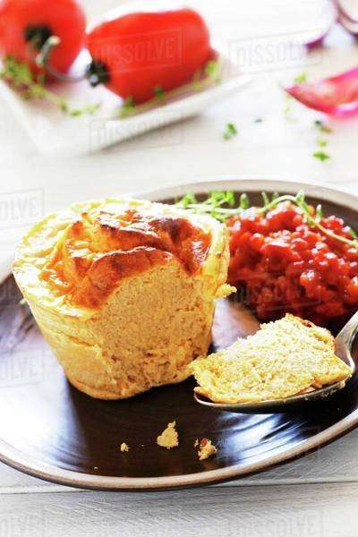 Fish souffle with a tomato and pepper sauce - Stock Photo - Dissolve