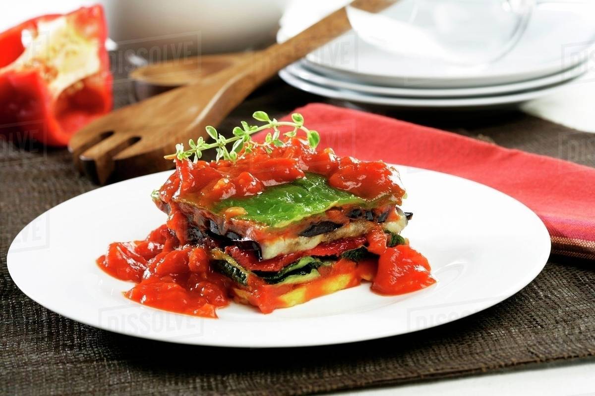 Layered grilled vegetables with tomato sauce - Stock Photo - Dissolve