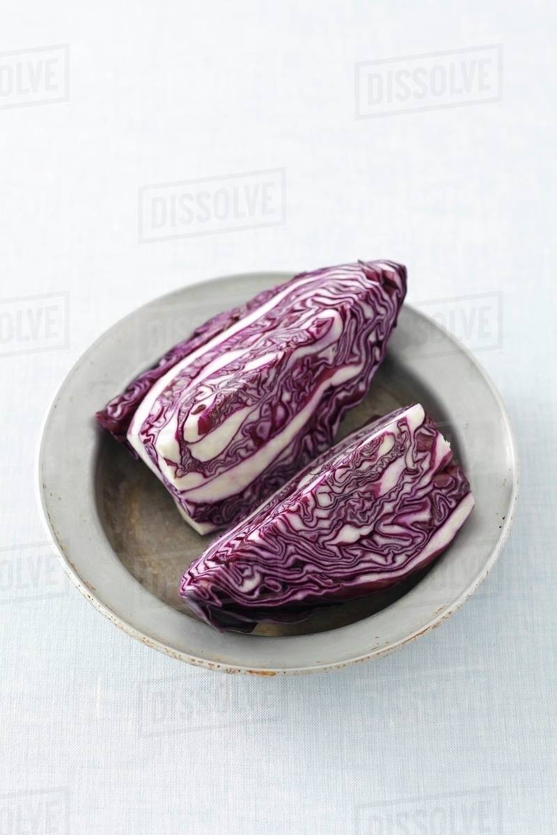 Two quarters of red cabbage on a plate - Royalty-free Stock Photo ...