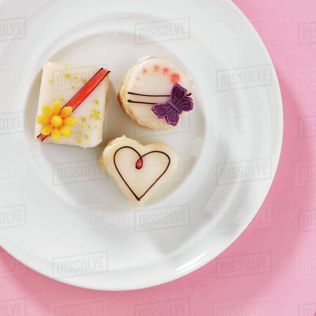 Petits fours with a spring theme on a plate (viewed from above) - Stock ...