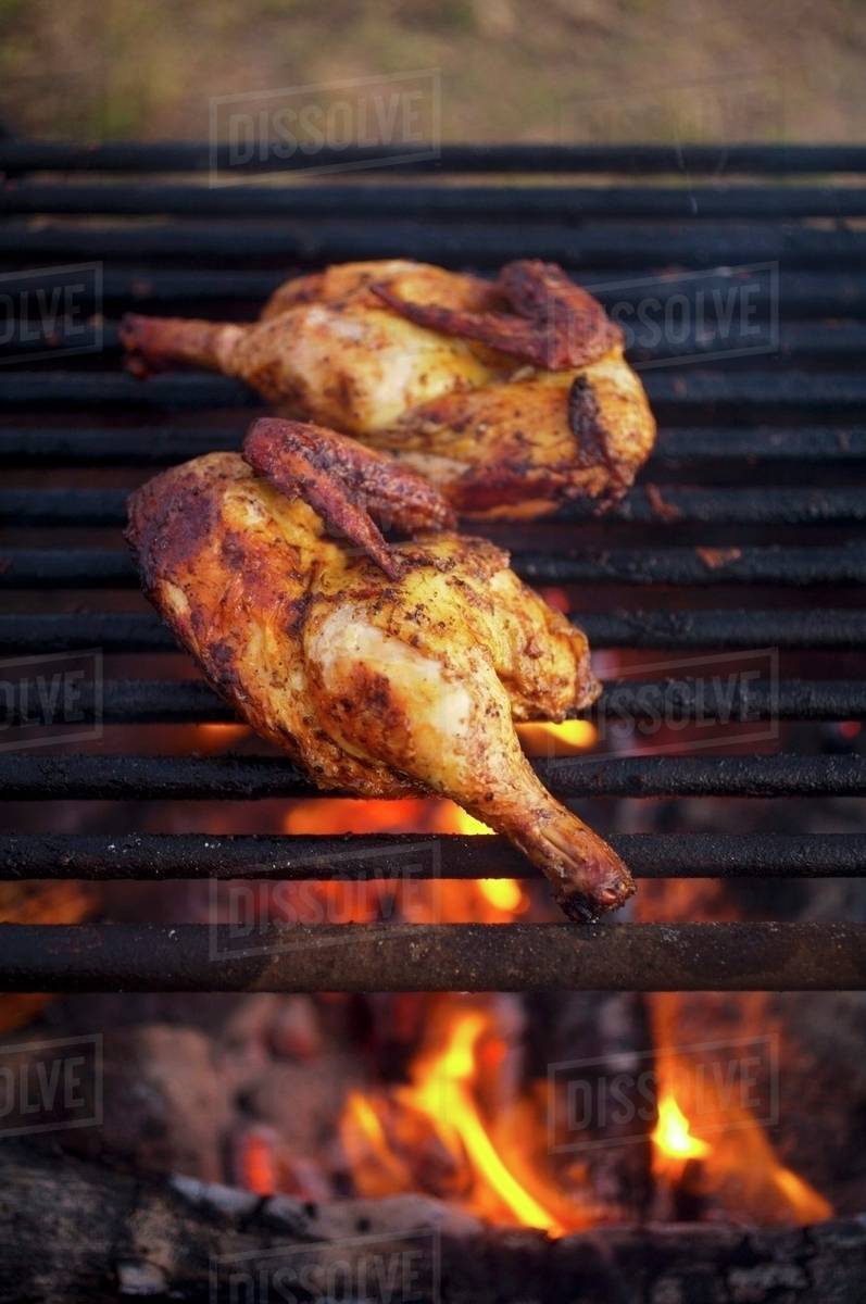 Half Chickens on a Grill - Royalty-free Stock Photo | Dissolve