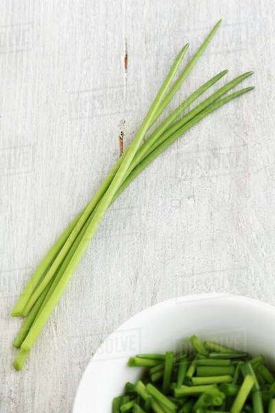 Chives, some chopped - Stock Photo - Dissolve
