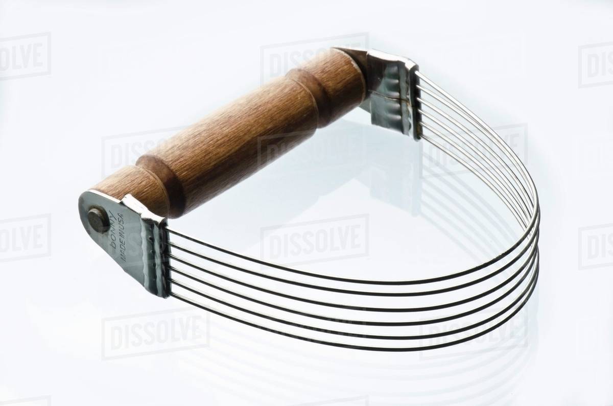Metal Pastry Cutter with Wooden Handle on a White Background - Royalty ...