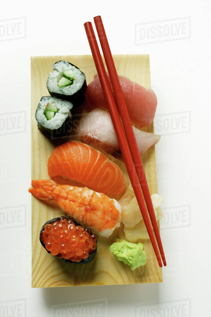 Mixed sushi platter with red chopsticks - Royalty-free Stock Photo ...