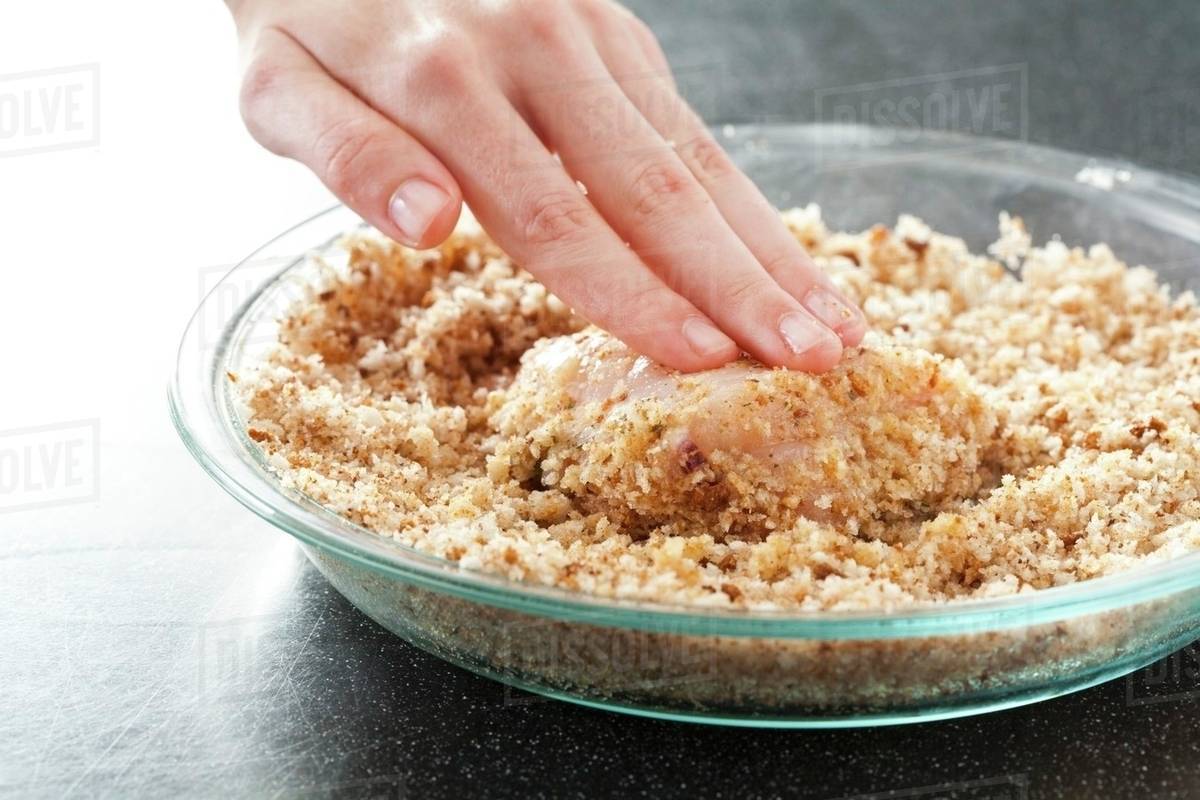 Coating Chicken in Bread Crumbs to Make Crunchy Baked Chicken - Royalty ...
