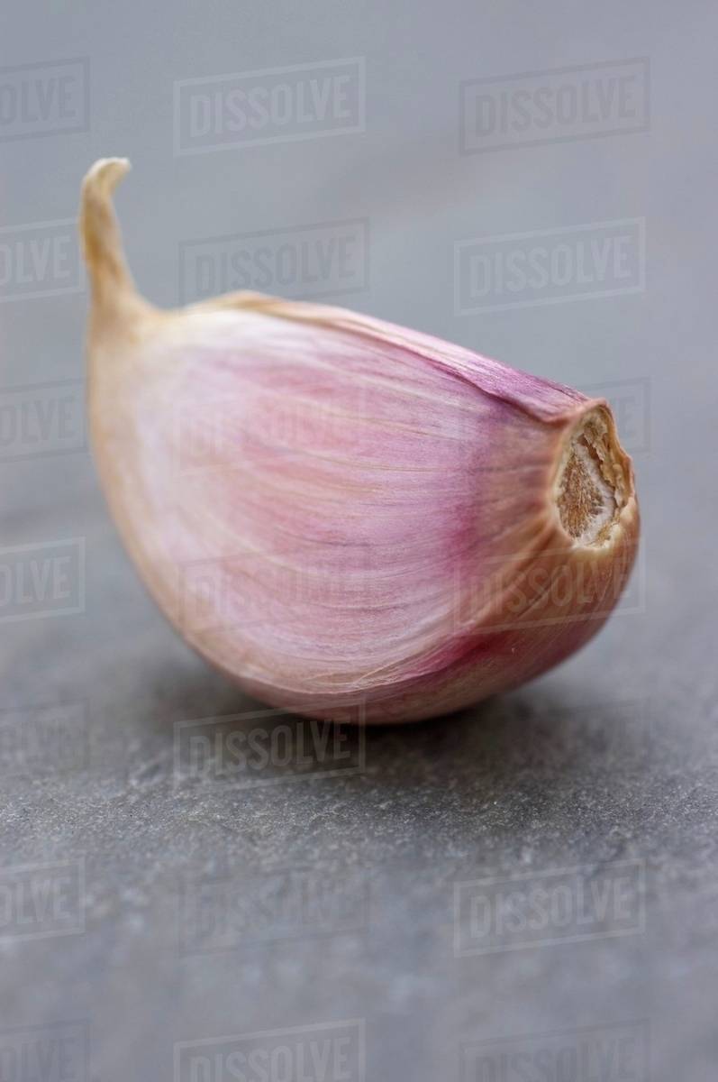 A garlic clove on a slate surface (close-up) - Royalty-free Stock Photo ...