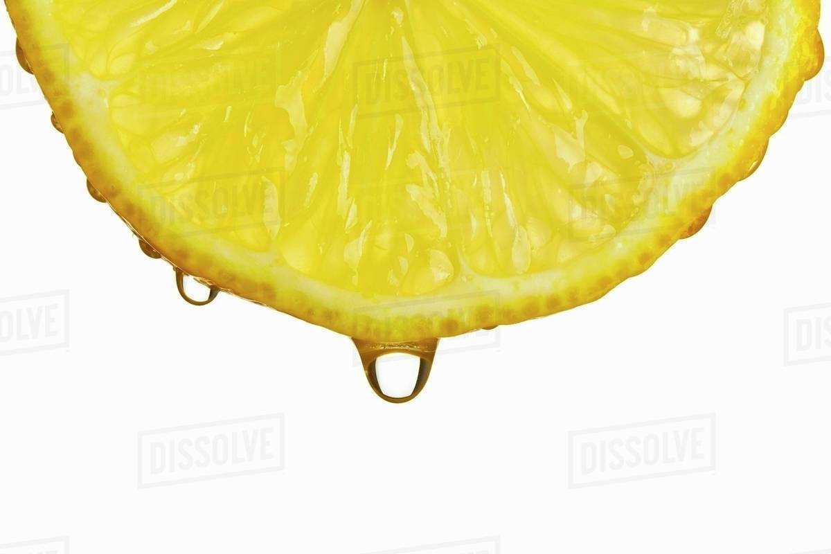 A dripping lemon slice - Royalty-free Stock Photo | Dissolve