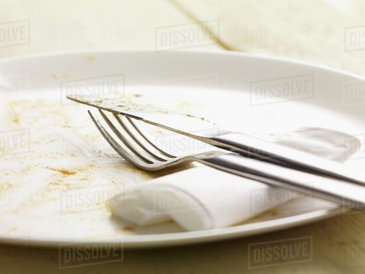 A dirty plate, cutlery and a paper napkin - Royalty-free Stock Photo ...