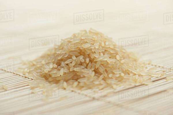 A heap of long-grain rice - Stock Photo - Dissolve