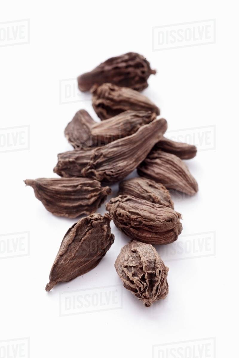 Black cardamon capsules - Stock Photo - Dissolve