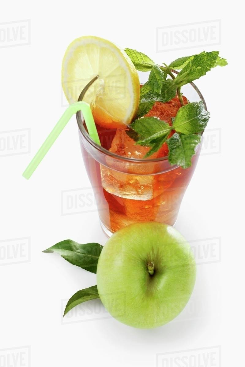 Iced tea with apples, lemon and mit - Stock Photo - Dissolve
