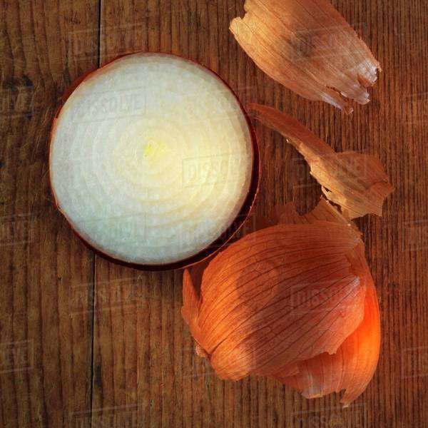 An onion with skin - Royalty-free Stock Photo | Dissolve