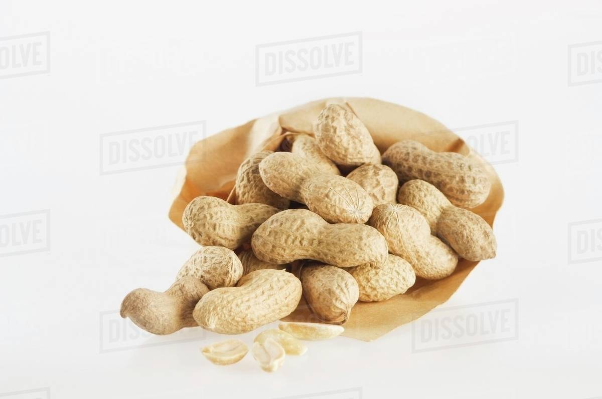 Peanuts in a paper bag - Stock Photo - Dissolve