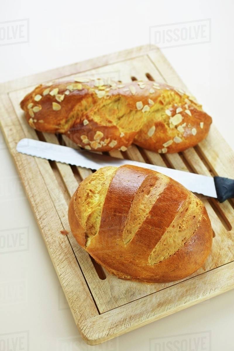 Two types of brioche on a wooden board - Royalty-free Stock Photo ...