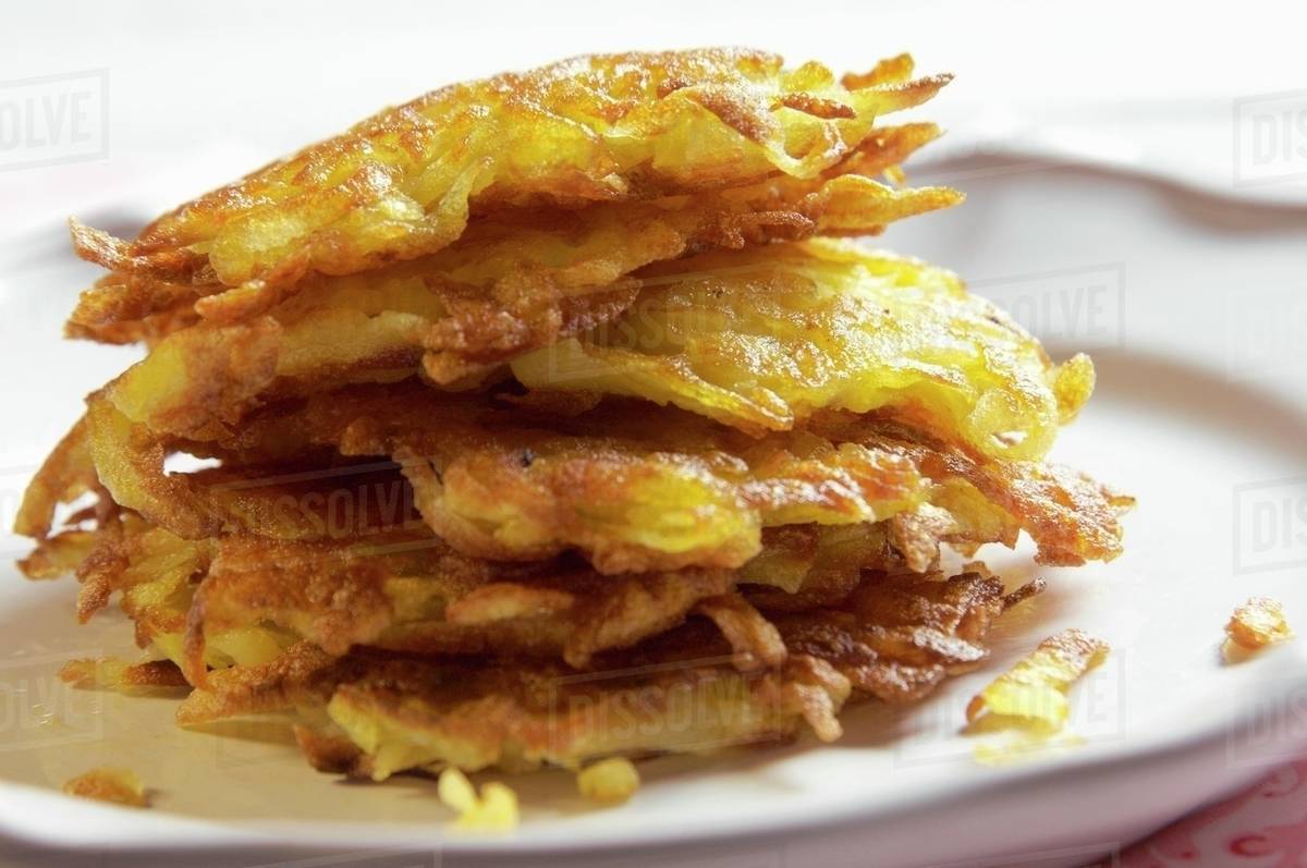 A stack of potato rosti (hash browns) on a plate - Royalty-free Stock ...
