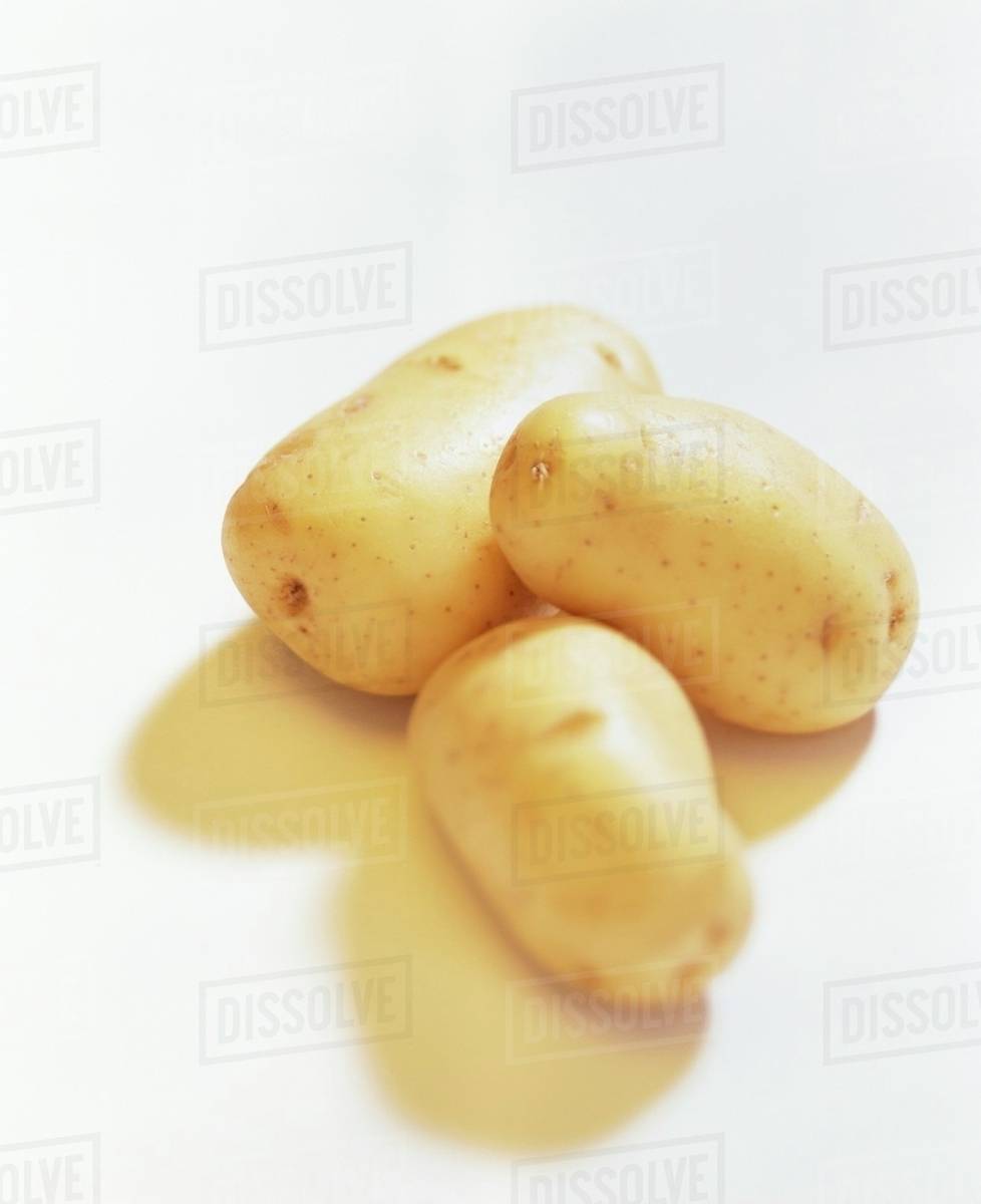 Three potatoes - Stock Photo - Dissolve
