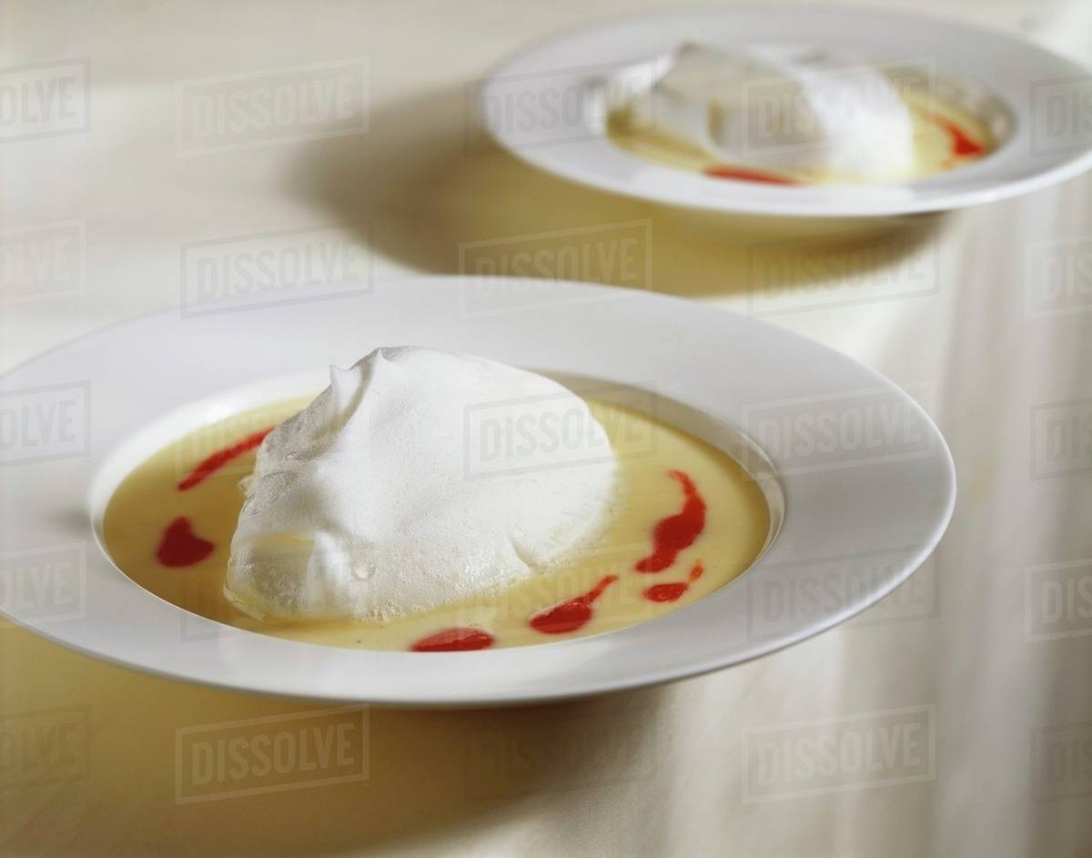 Poached meringue in custard - Royalty-free Stock Photo | Dissolve