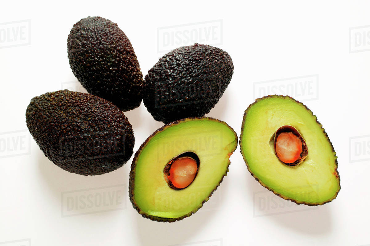 Mini-avocados, whole and halved - Royalty-free Stock Photo | Dissolve