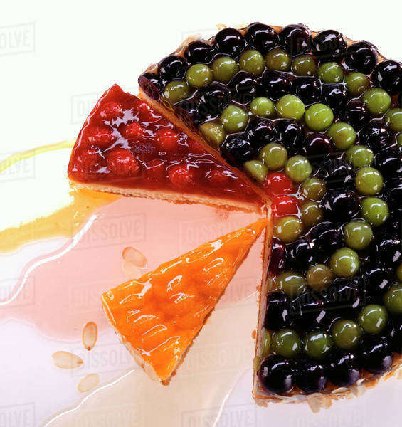 Fruit torte, pieces cut - Royalty-free Stock Photo | Dissolve