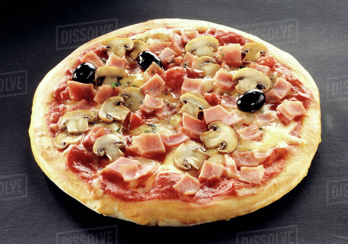 Pizza with ham, mushrooms and olives - Stock Photo - Dissolve