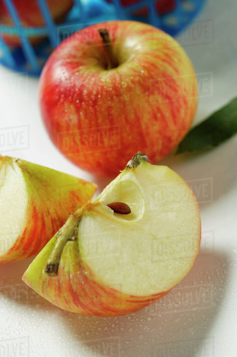 Fresh apple and apple wedges - Stock Photo - Dissolve