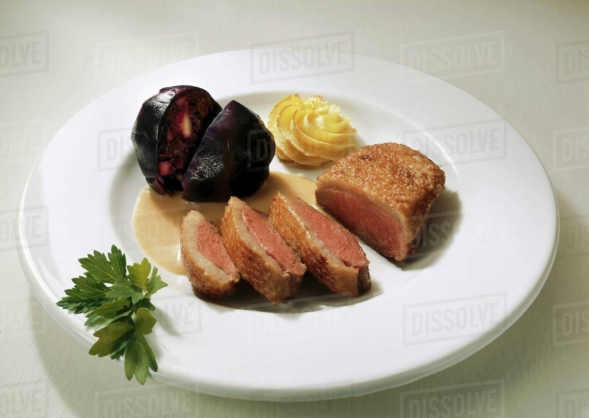 Duck breast with red cabbage dumpling - Royalty-free Stock Photo | Dissolve
