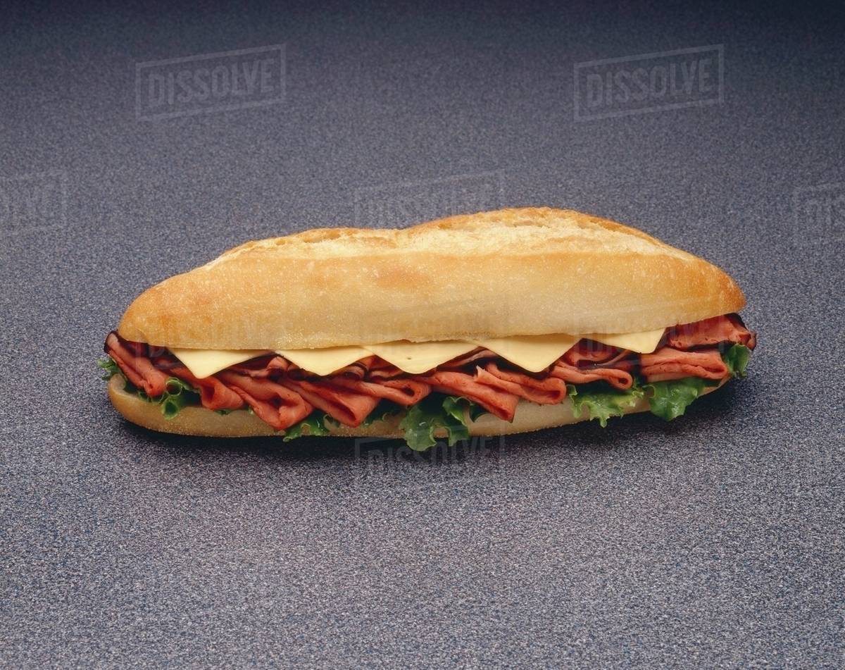 Roast Beef and American Cheese Submarine Sandwich - Stock Photo - Dissolve