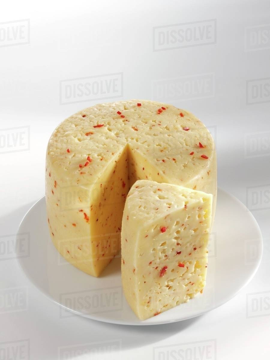 Tilsiter cheese with red pepper - Royalty-free Stock Photo | Dissolve