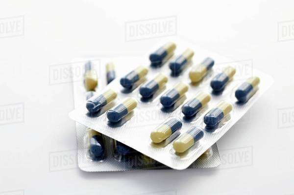 Two packs of capsules for treating depression - Stock Photo - Dissolve