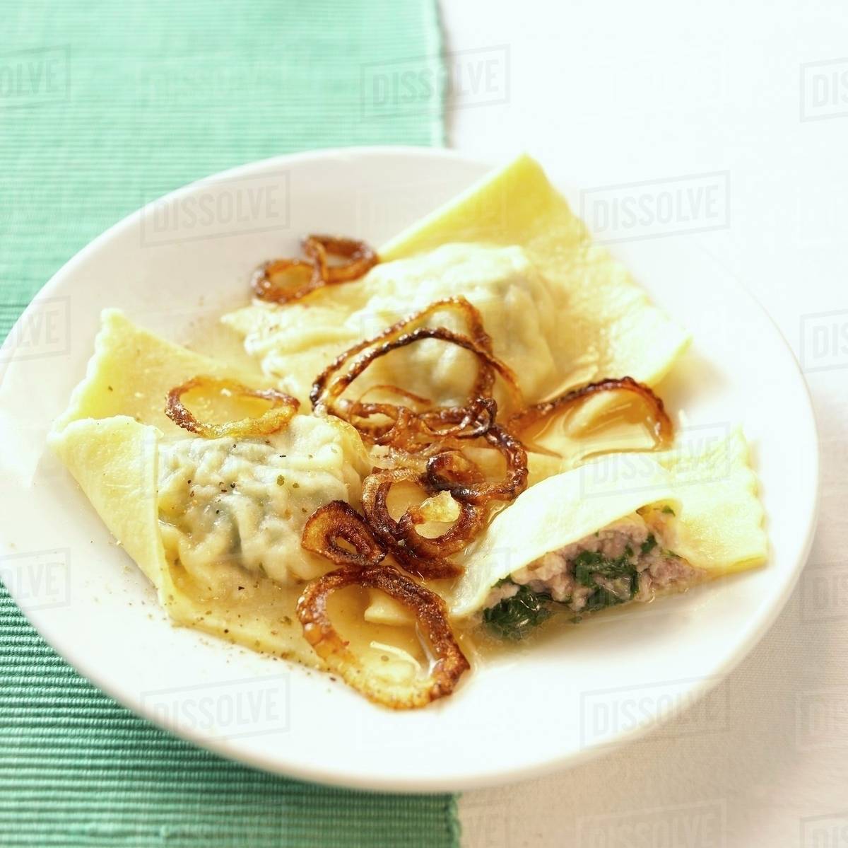 Swabian Maultaschen (filled pasta parcels) with fried onions - Royalty ...
