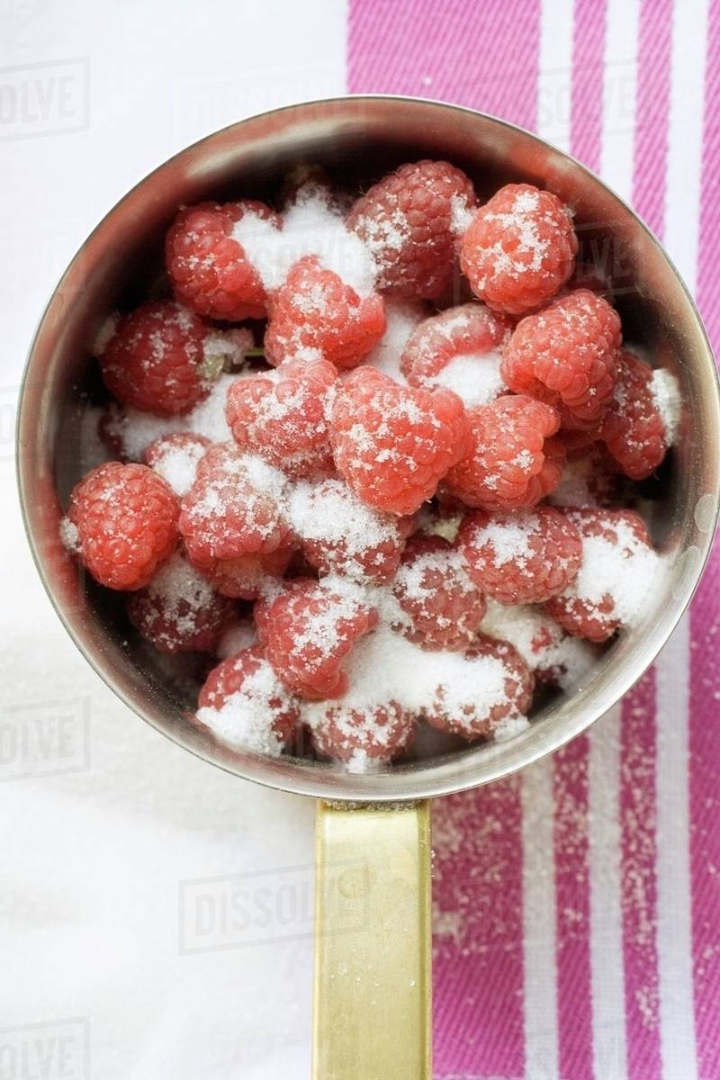 Sugared raspberries in a pan (overhead view) - Royalty-free Stock Photo ...