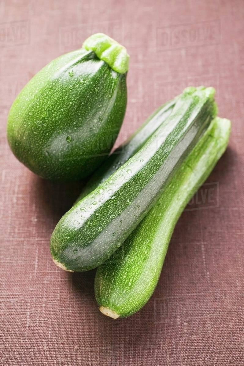 Round and long courgettes with drops of water - Royalty-free Stock ...