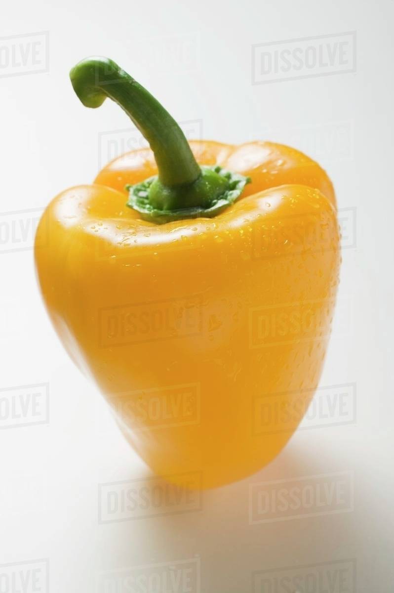 Yellow pepper with drops of water - Royalty-free Stock Photo | Dissolve