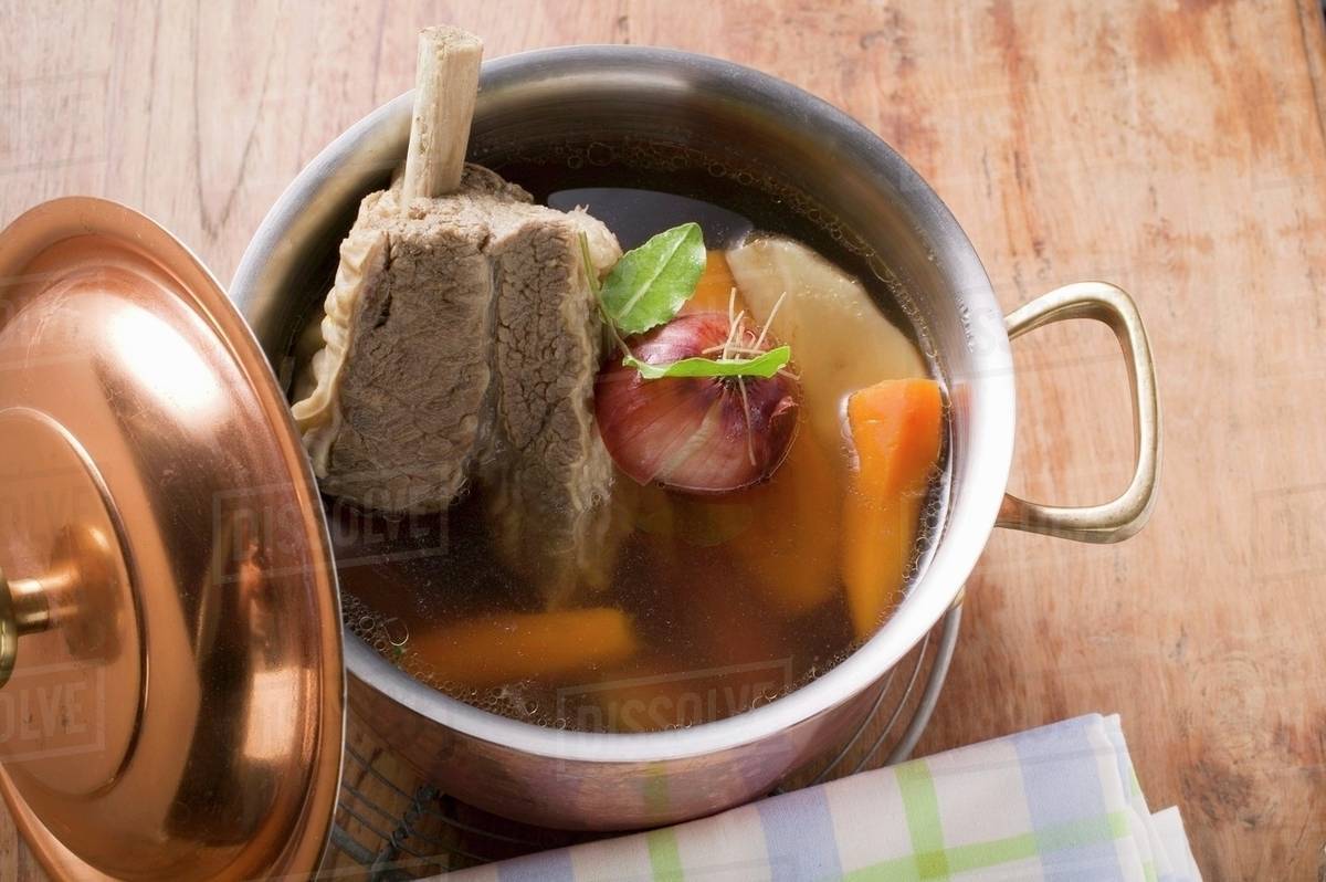 Broth with beef and soup vegetables in pot - Royalty-free Stock Photo ...