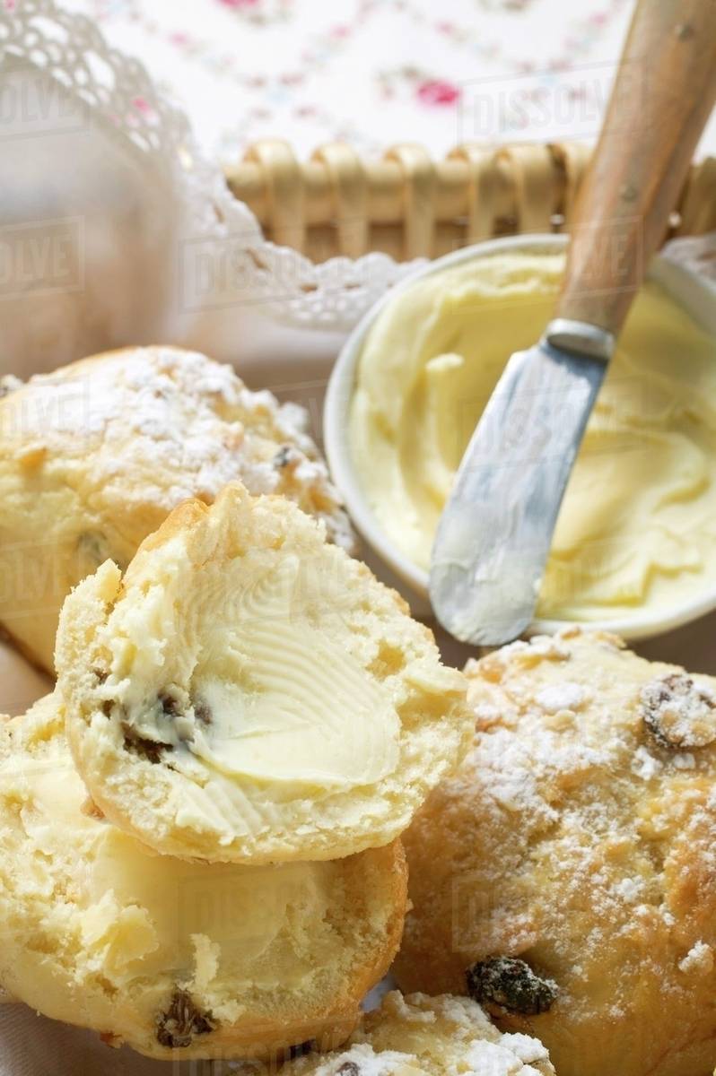 Sugared raisin scones with butter in bread basket - Royalty-free Stock ...