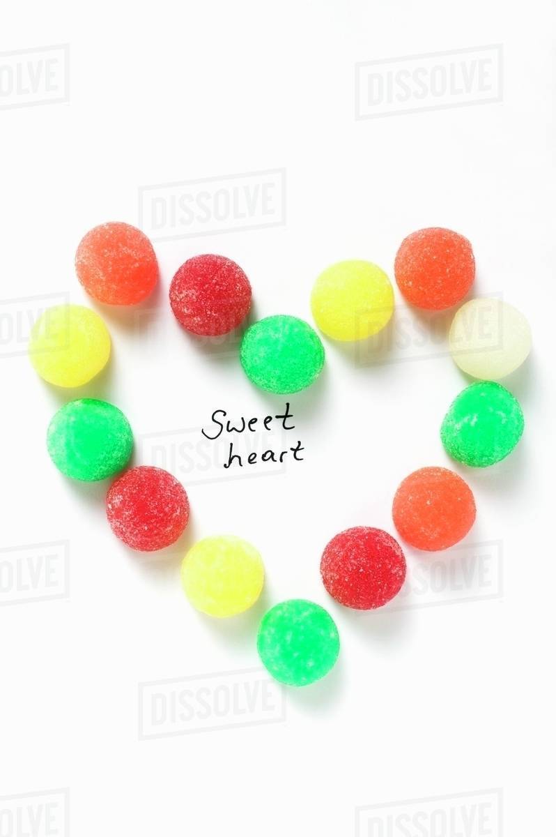 Coloured jelly sweets forming heart with the words 'Sweet heart ...