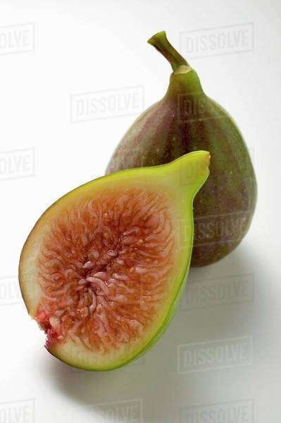 Whole fig and half a fig - Stock Photo - Dissolve