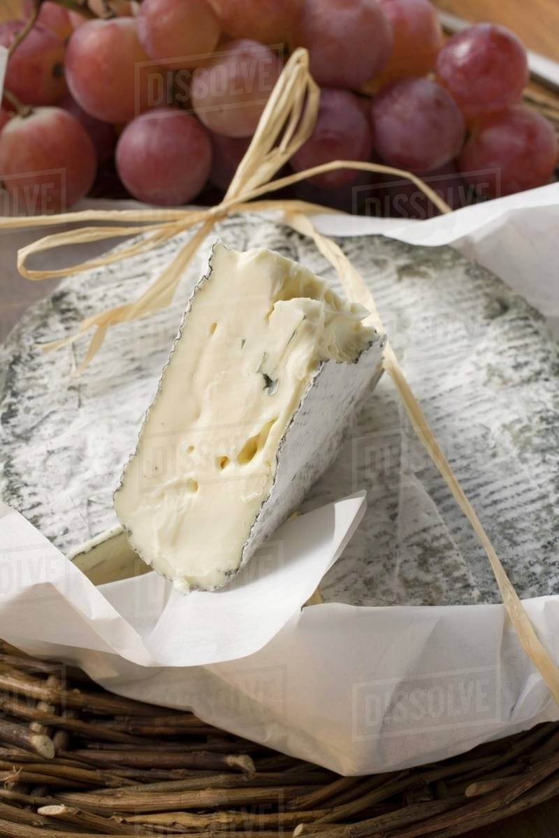 Blue cheese (Bresse Bleu, France) and grapes - Stock Photo - Dissolve